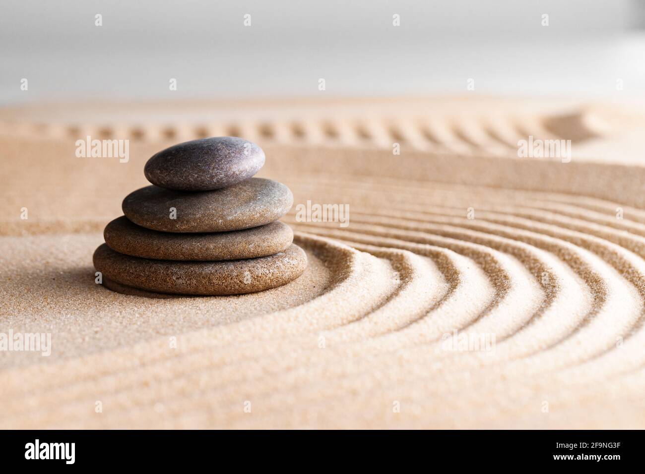Japanese zen garden with stone in raked sand Stock Photo - Alamy