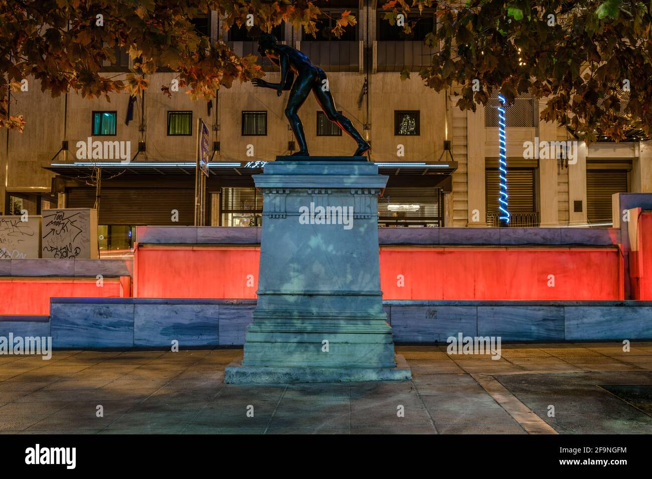 night view of statue of a running boy situated on the sytagma square in ...