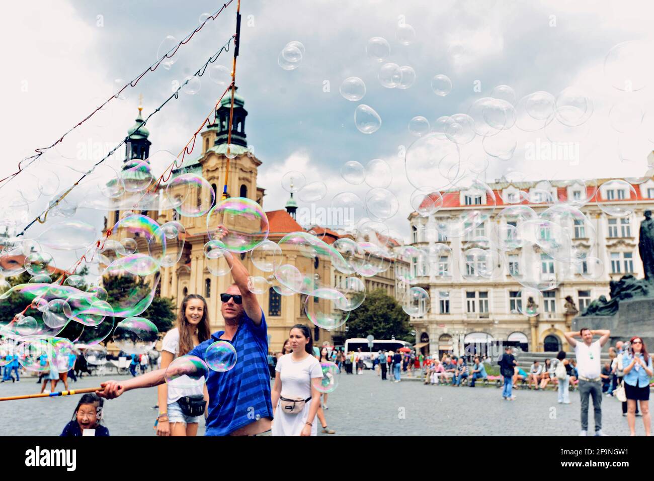 Architecture and landmark of Prague, children playing in Soap Bubbles ...