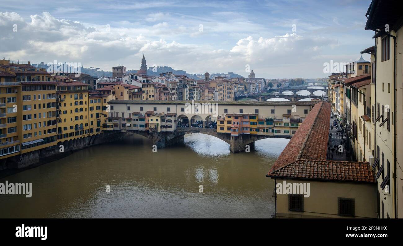 Florence, Italy. Ponte Vecchio bridge and River Arno at day from Ponte ...