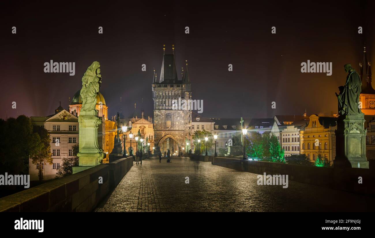 Charles Bridge (Karluv most) with Gothic statues in Prague old town, Czech Republic at night ...