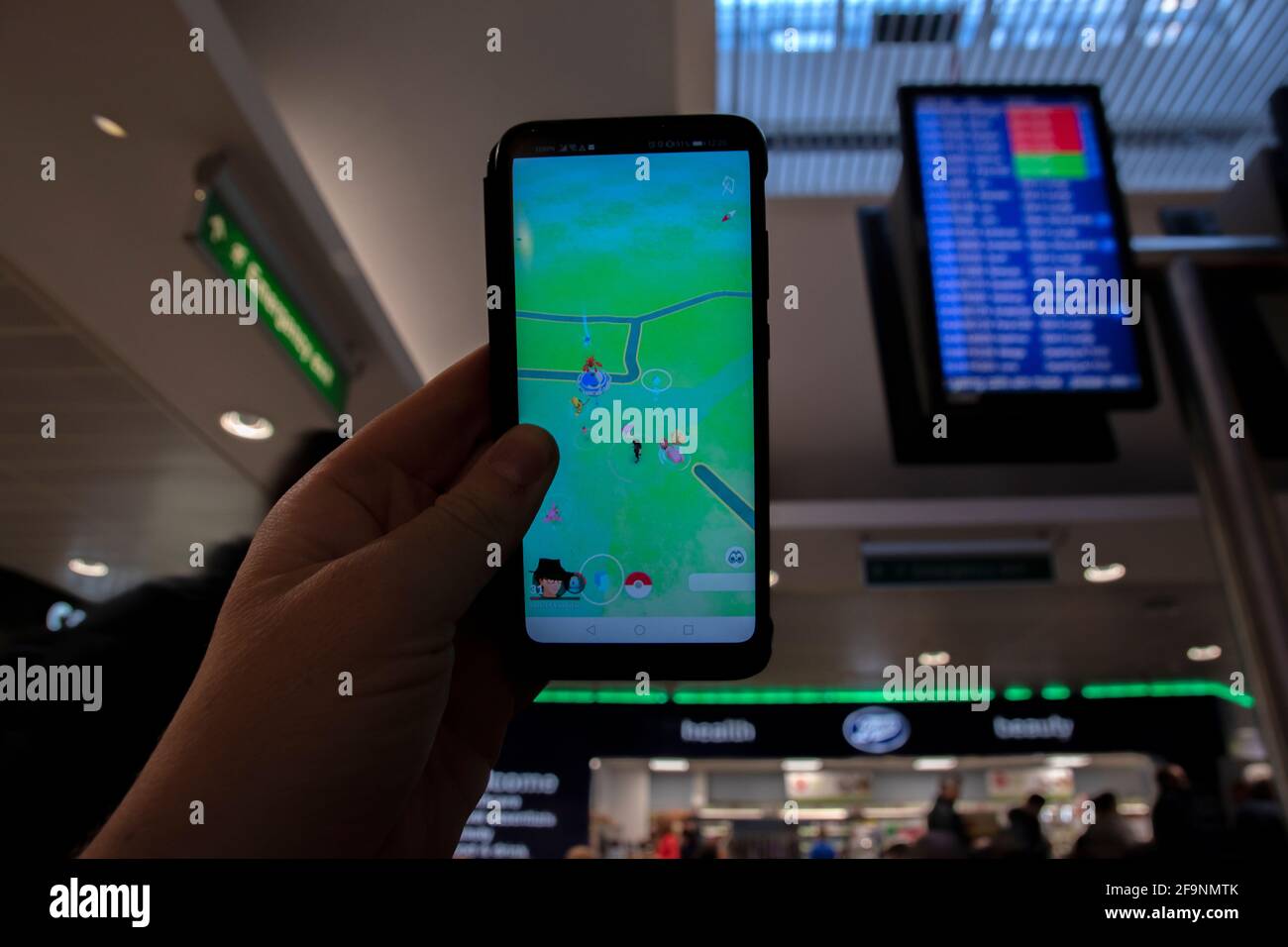 Playing Pokemon Go At The Manchester Airport England 9-12-2019 Stock ...