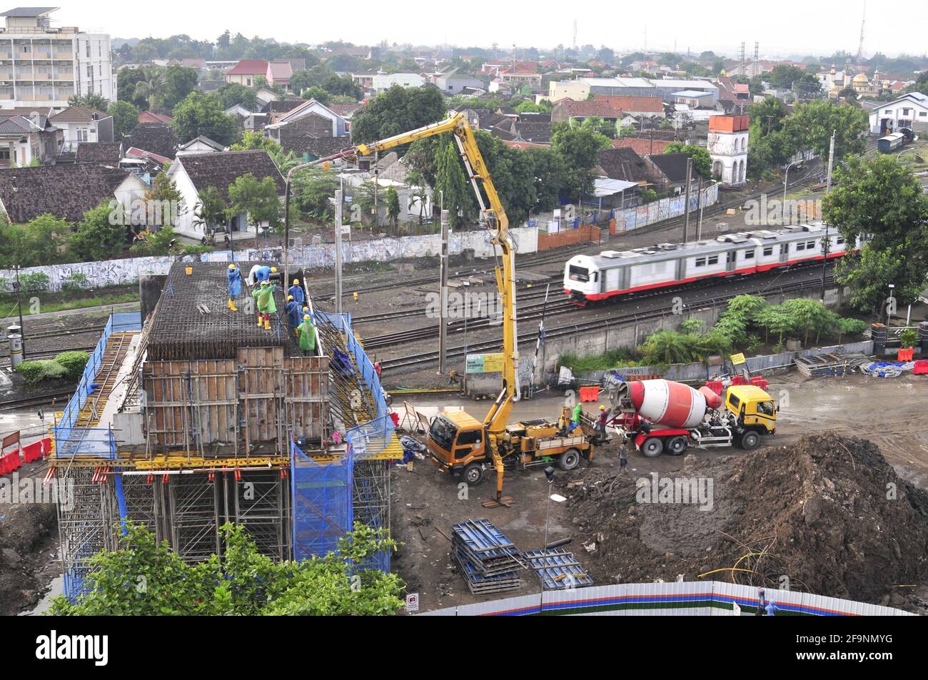 construction workers are working at a construction site in Solo ...