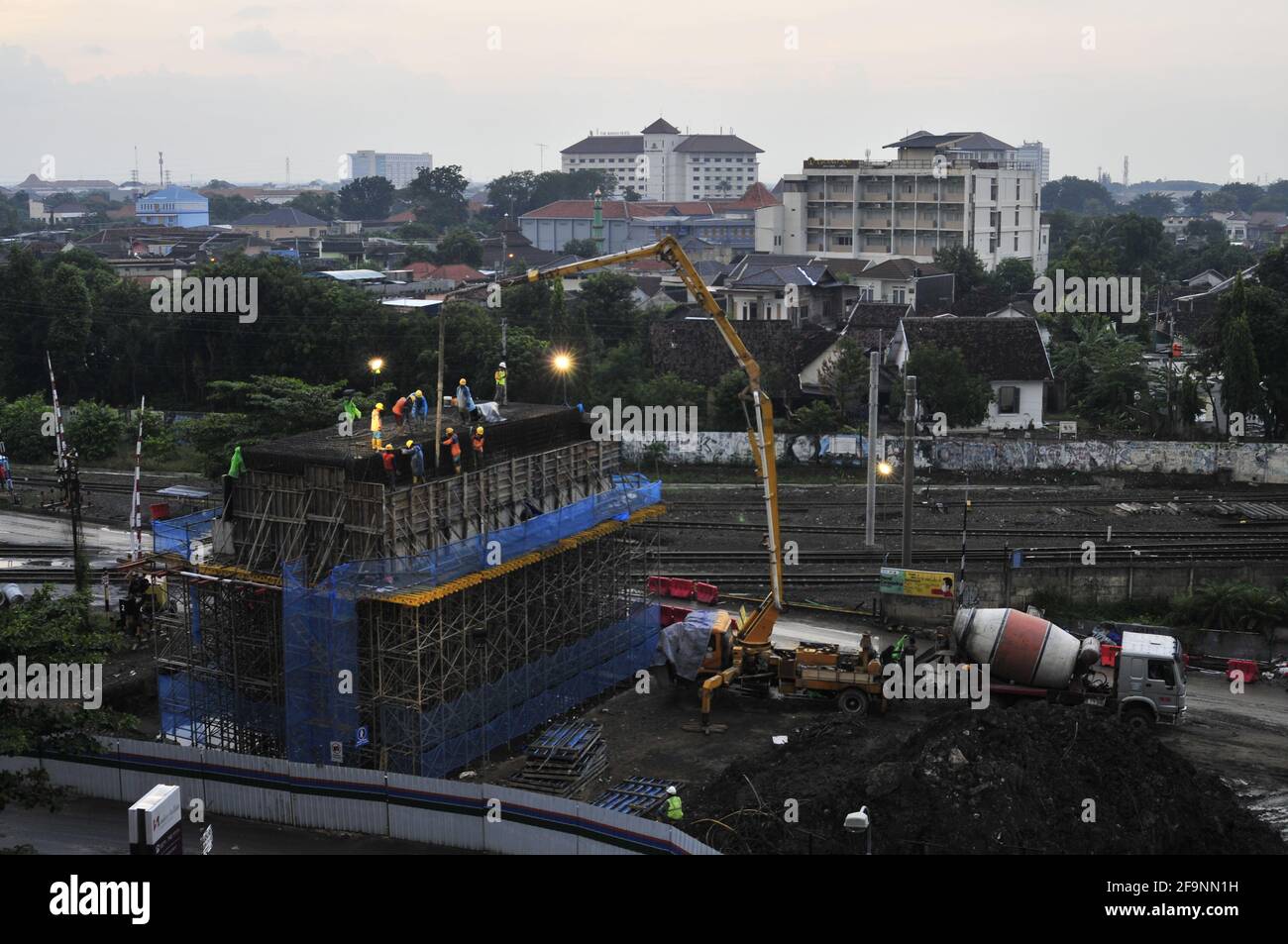 construction workers are working at a construction site in Solo ...
