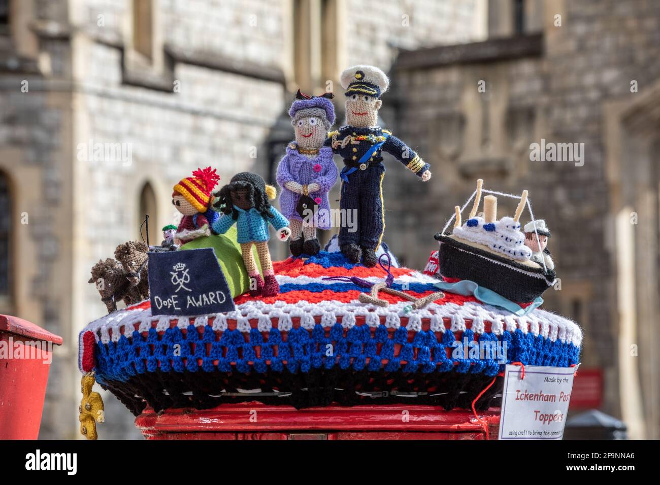 Knitted figures of Queen Elizabeth and Prince Philip on top of a ...