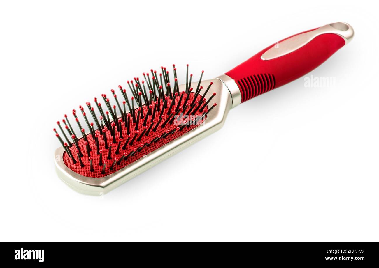 The Massage red comb isolated on white background Stock Photo - Alamy