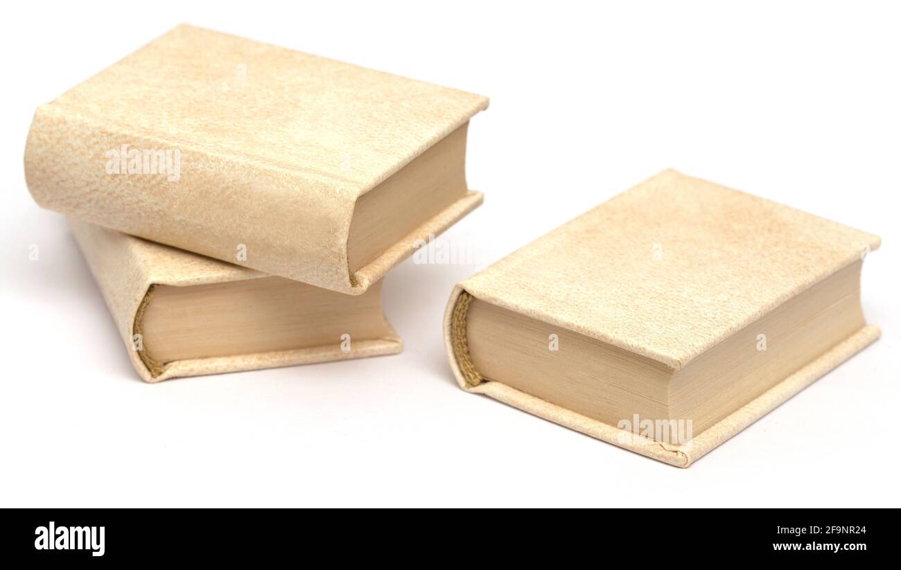 Three books over white background Stock Photo - Alamy