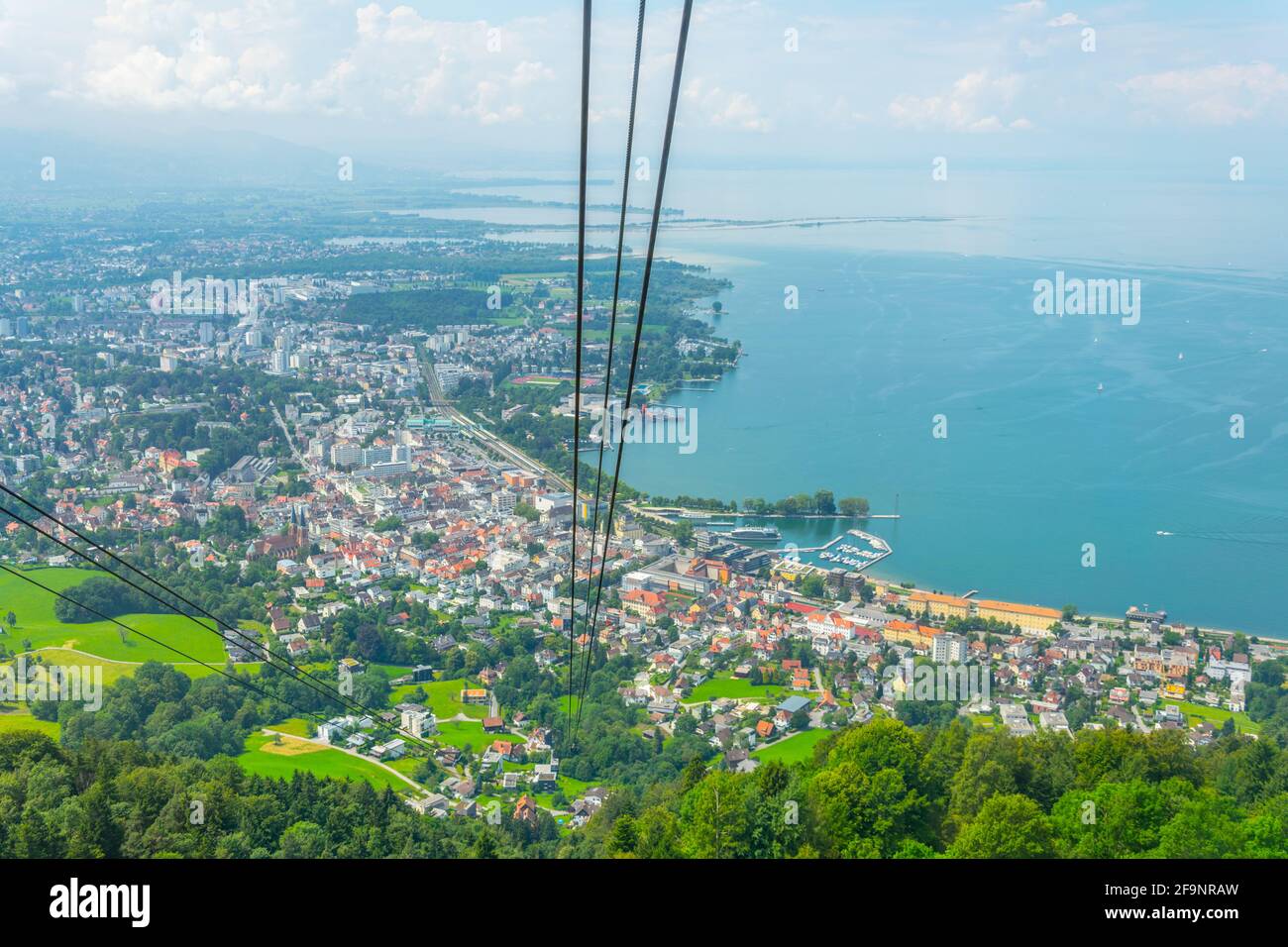 View of a pfanderbahn cable car with the Austrian city Bregenz behind ...