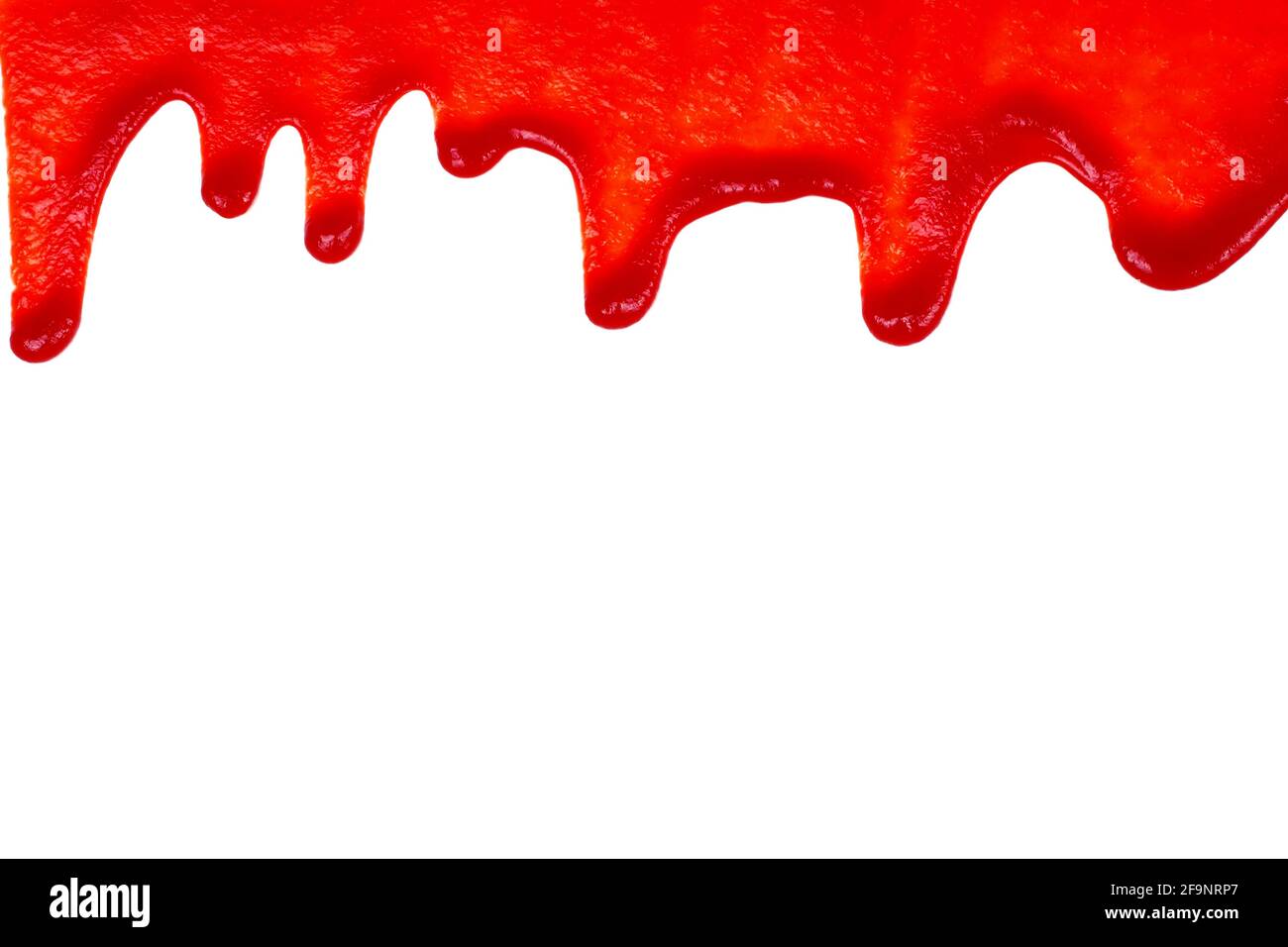 Red ketchup dripping on white background close-up Stock Photo - Alamy