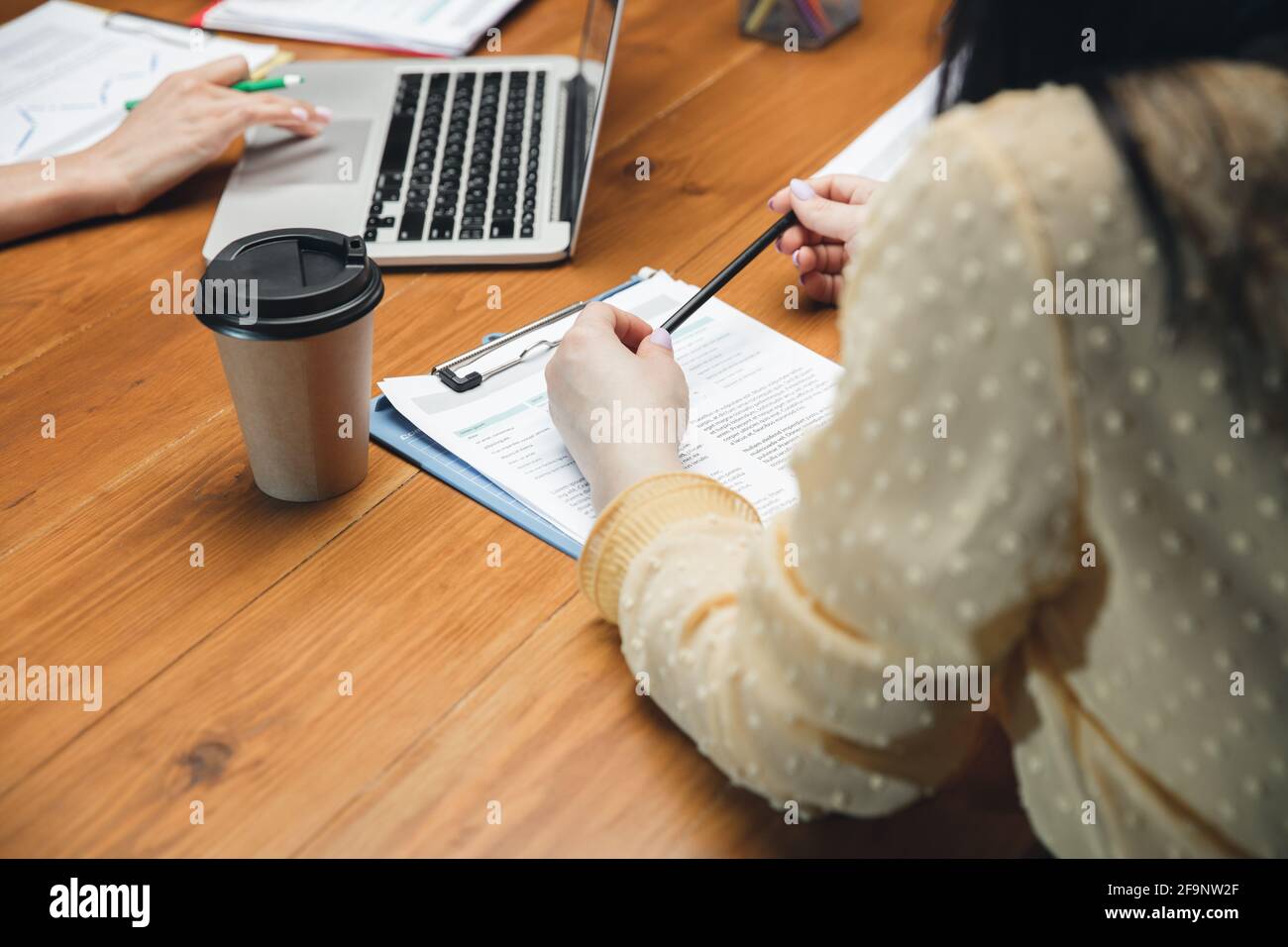 Close up hands of people, managers working in modern office using ...