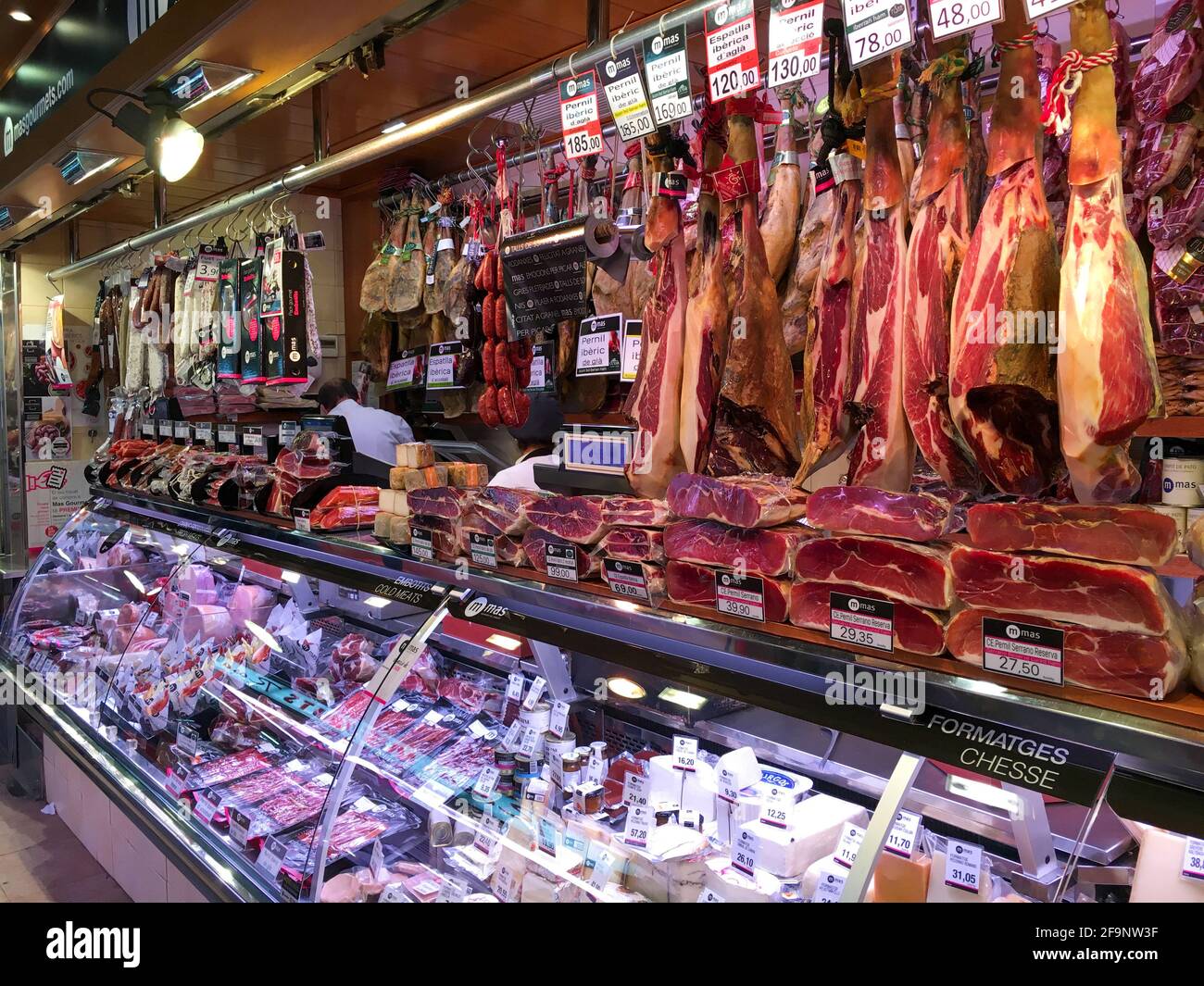 Sale of jamon and other meat delicacies in the famous market La ...