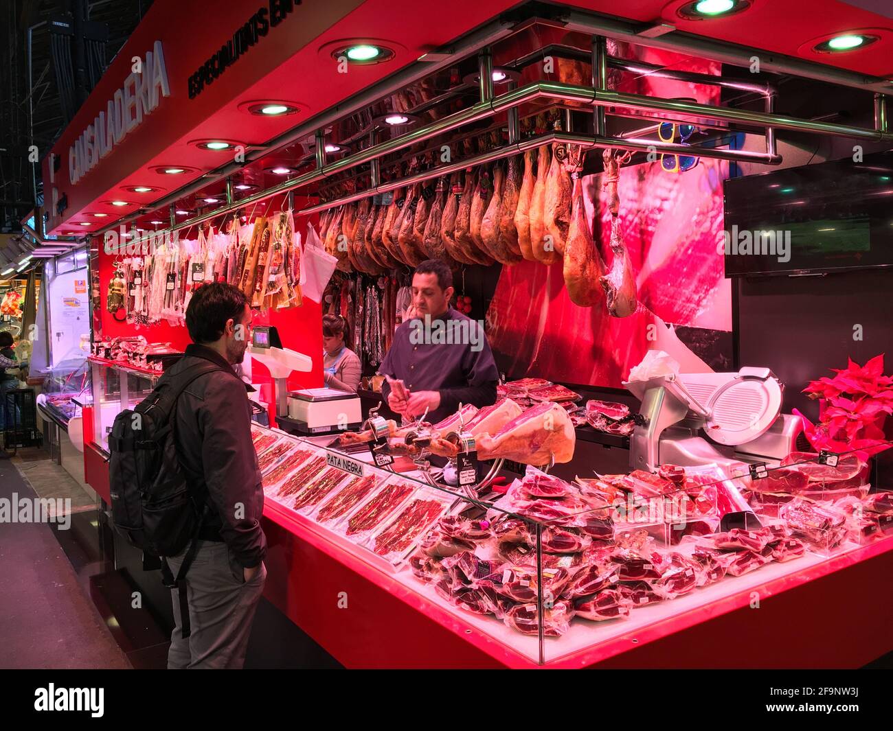 Sale of jamon and other meat delicacies in the famous market La ...