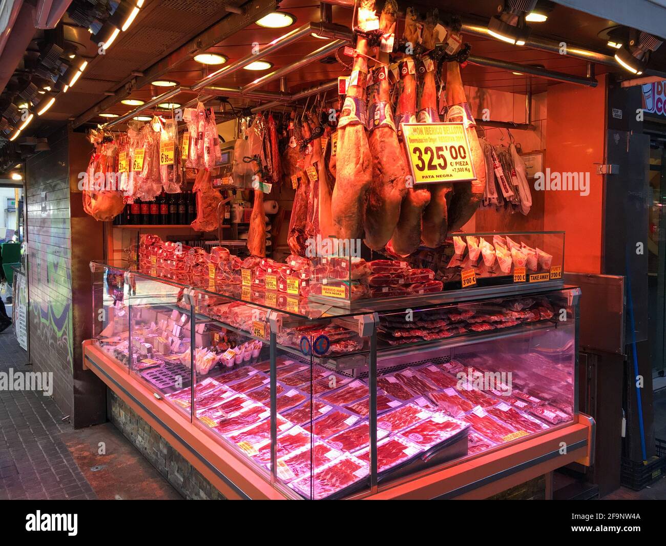 Sale of jamon and other meat delicacies in the famous market La ...