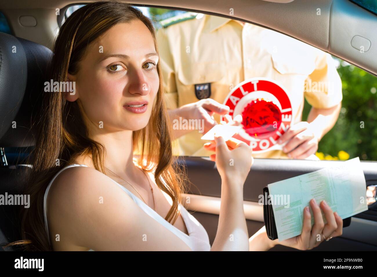 Policeman checking identification hi-res stock photography and images ...