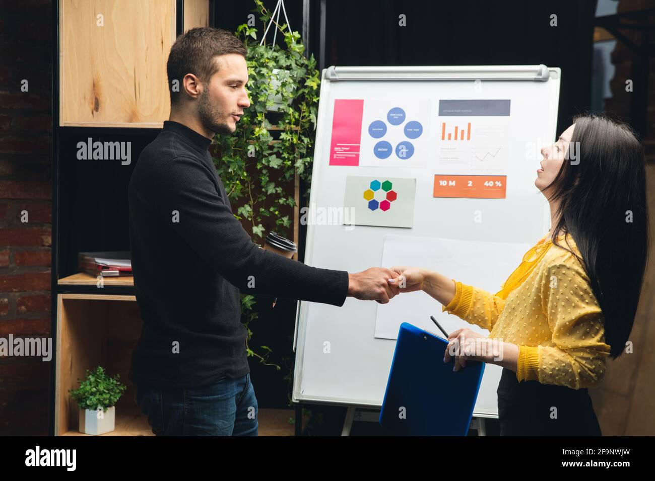 While colleagues working flipchart background hi-res stock photography ...