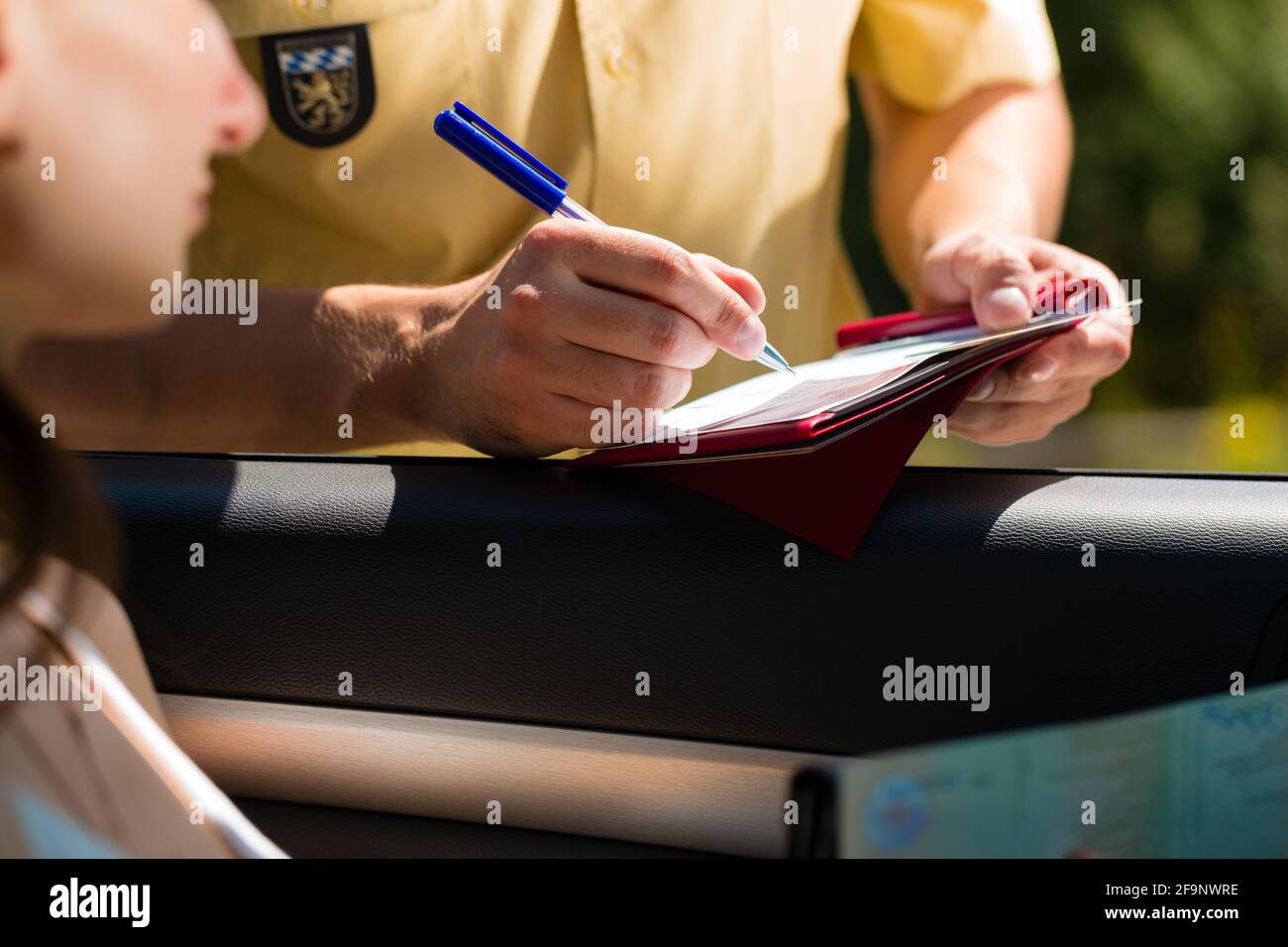 Police - young woman with policeman or cop on the street or traffic ...