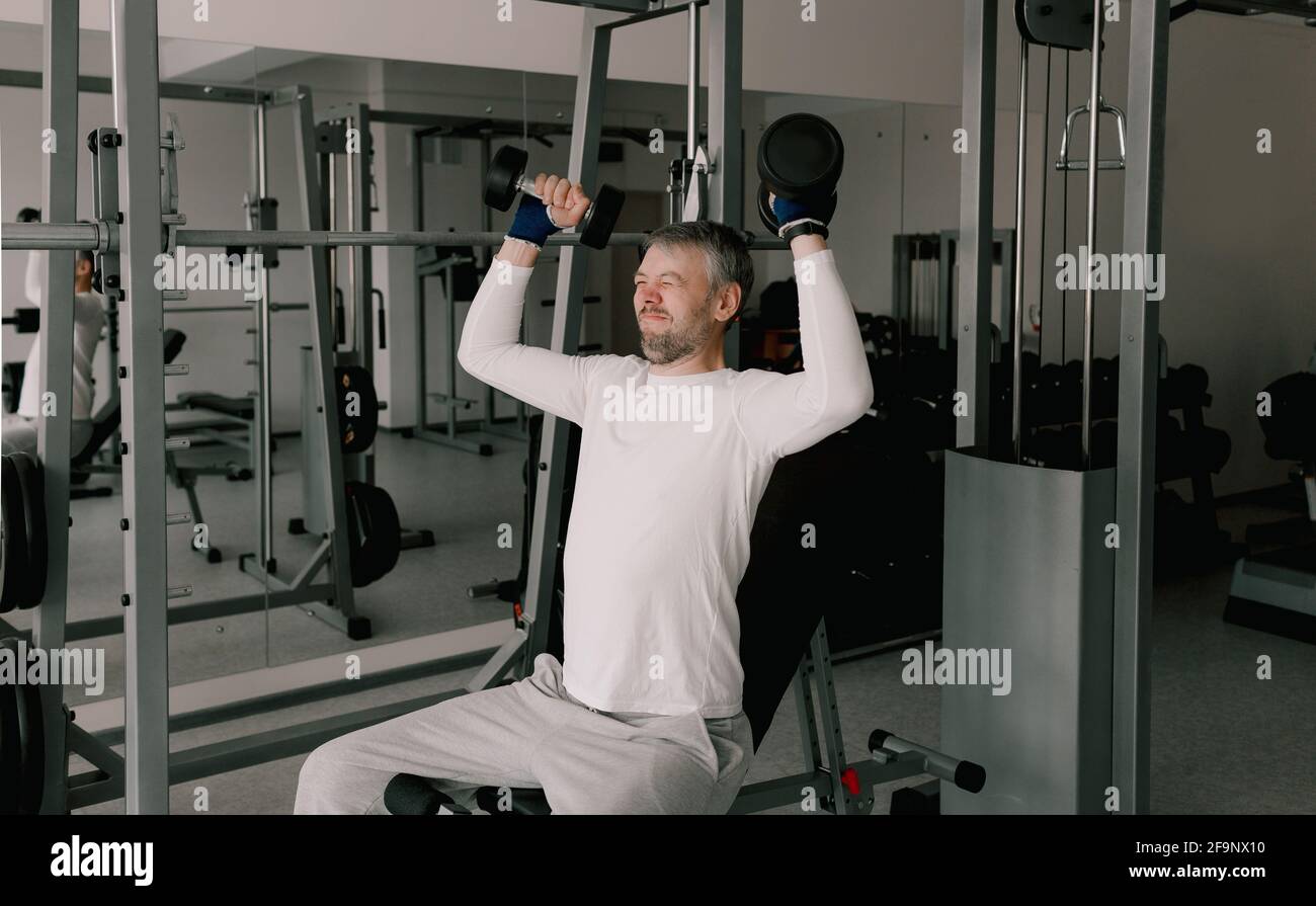 Handsome bodybuilder sitting on bench hi-res stock photography and ...