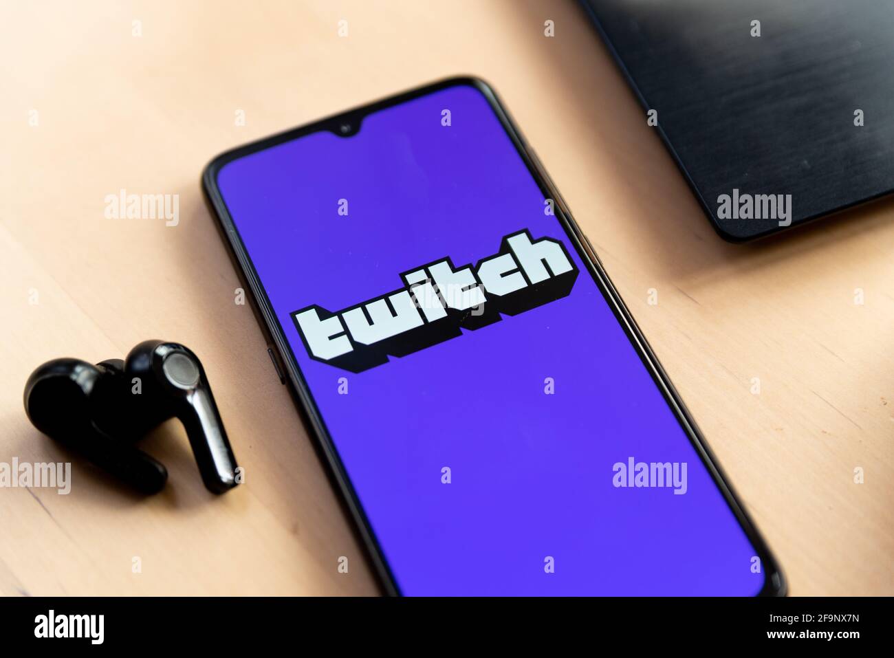 Barcelona, Spain - 20 april 2021: a mobile phone laying wood desk with ...