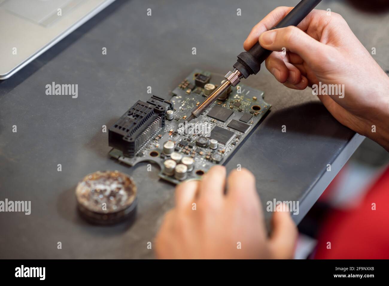 Male experienced hands soldering the microcircuit Stock Photo - Alamy