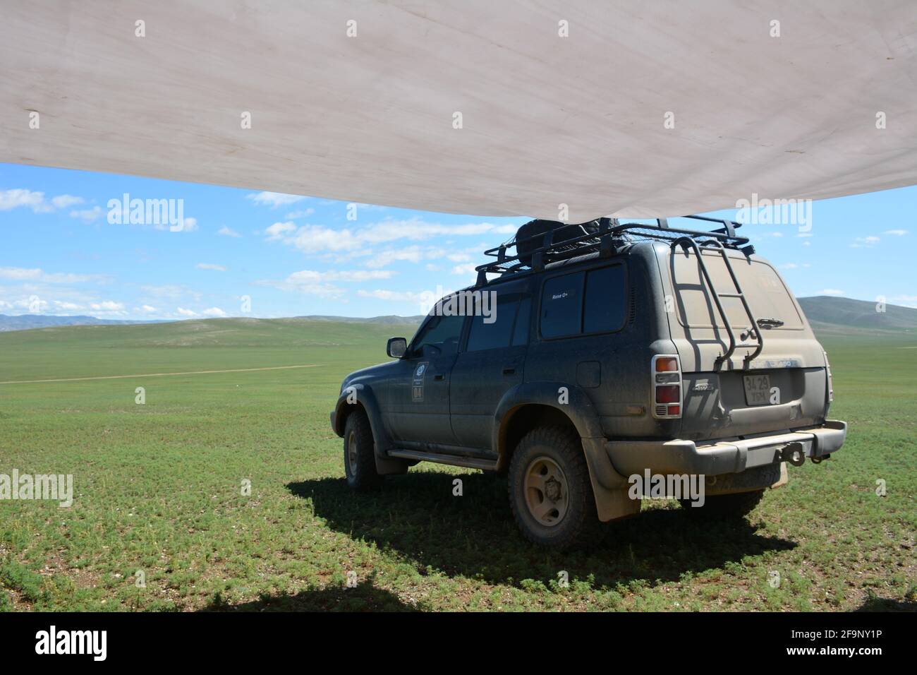 A Lexus 450 on an off-road trip through Mongolia. The car was almost ...