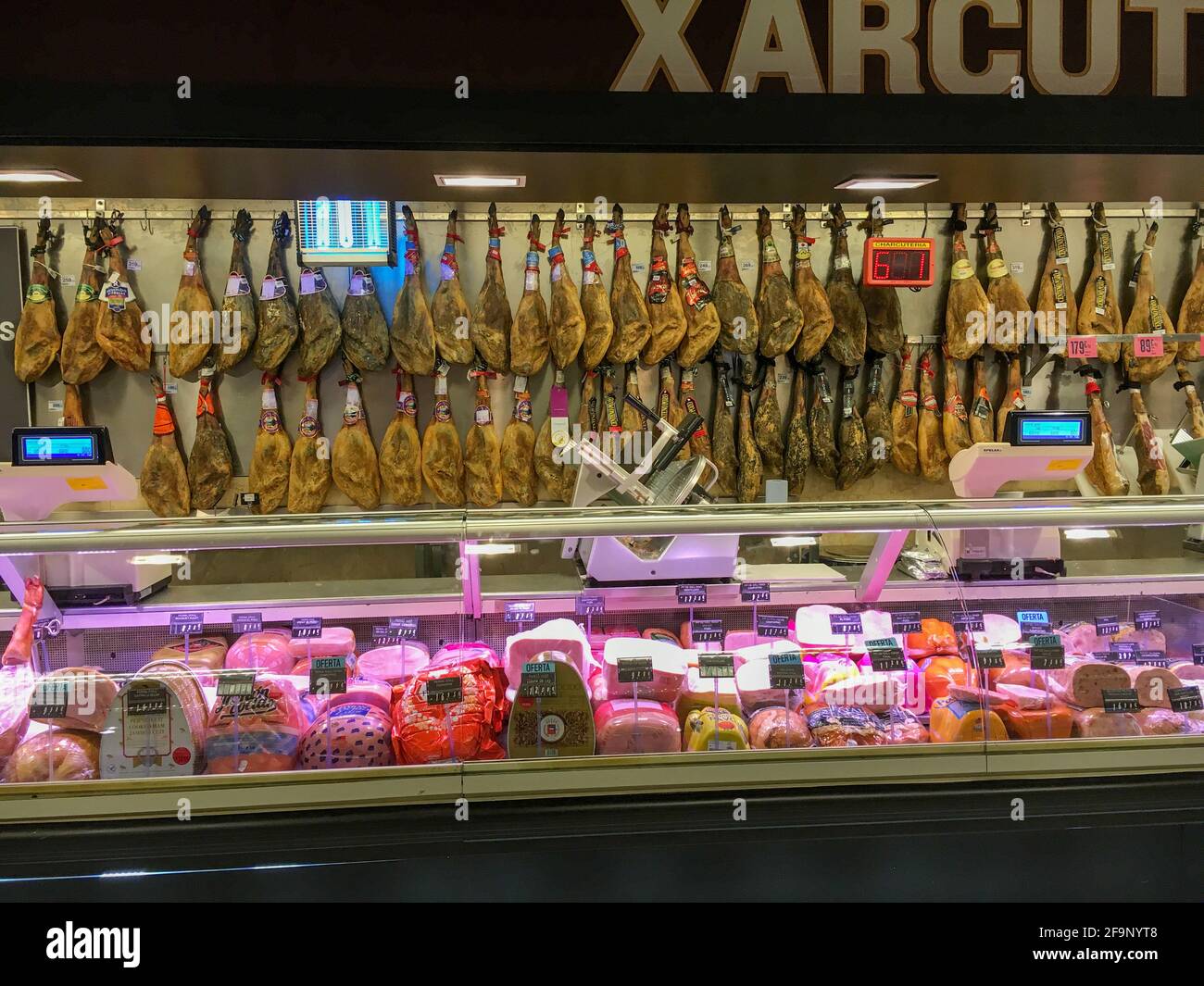 Hamon Store At Supermarket in Barcelona, Spain. Jamon of different ...