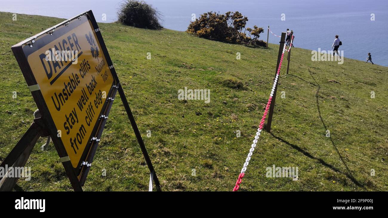 Unstable Cliffs following cliff fall at Seatown, people shown close to ...