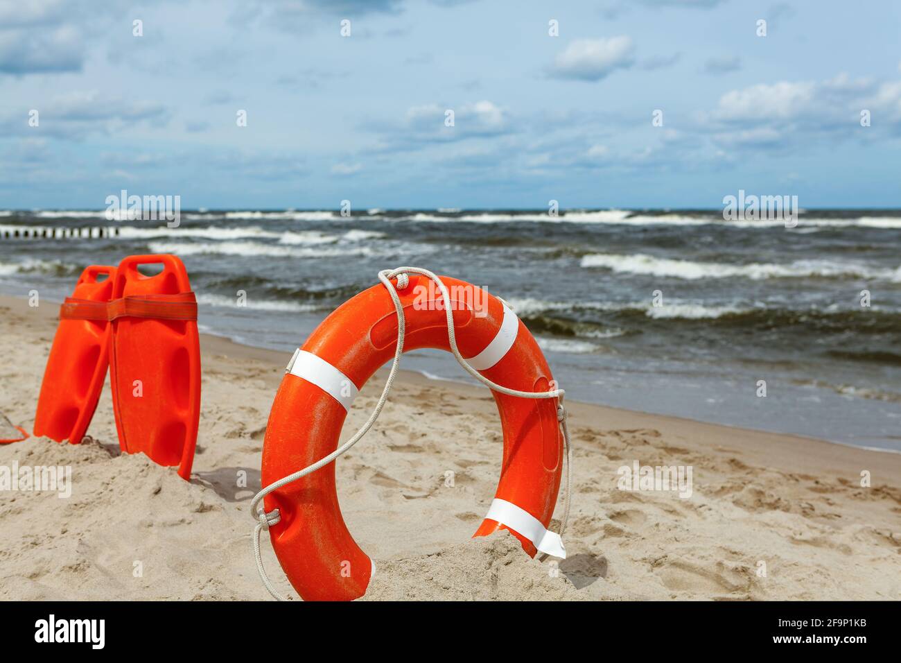 A red lifeguard stuck in the sand on the beach Stock Photo - Alamy