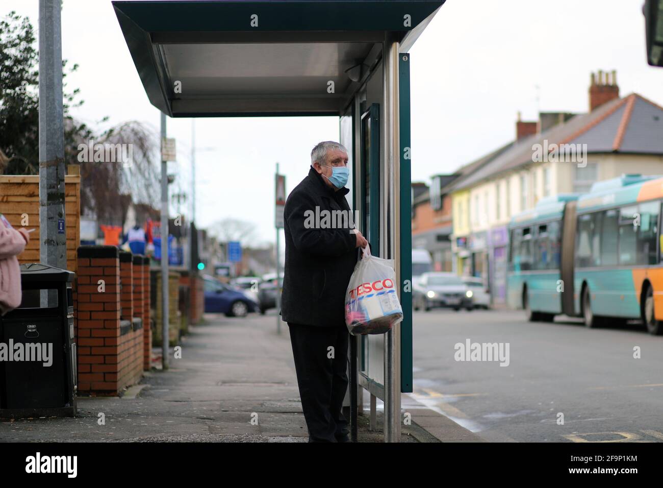 Chapter bus stop, Canton, Cardiff. 2nd February 2021. A man waiting to ...