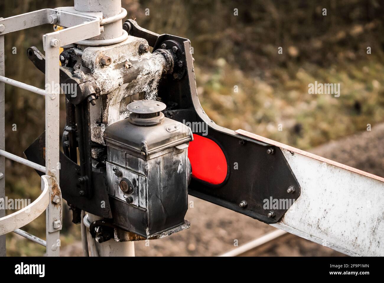Old railway signal restored showing red stop light and lap behind ...