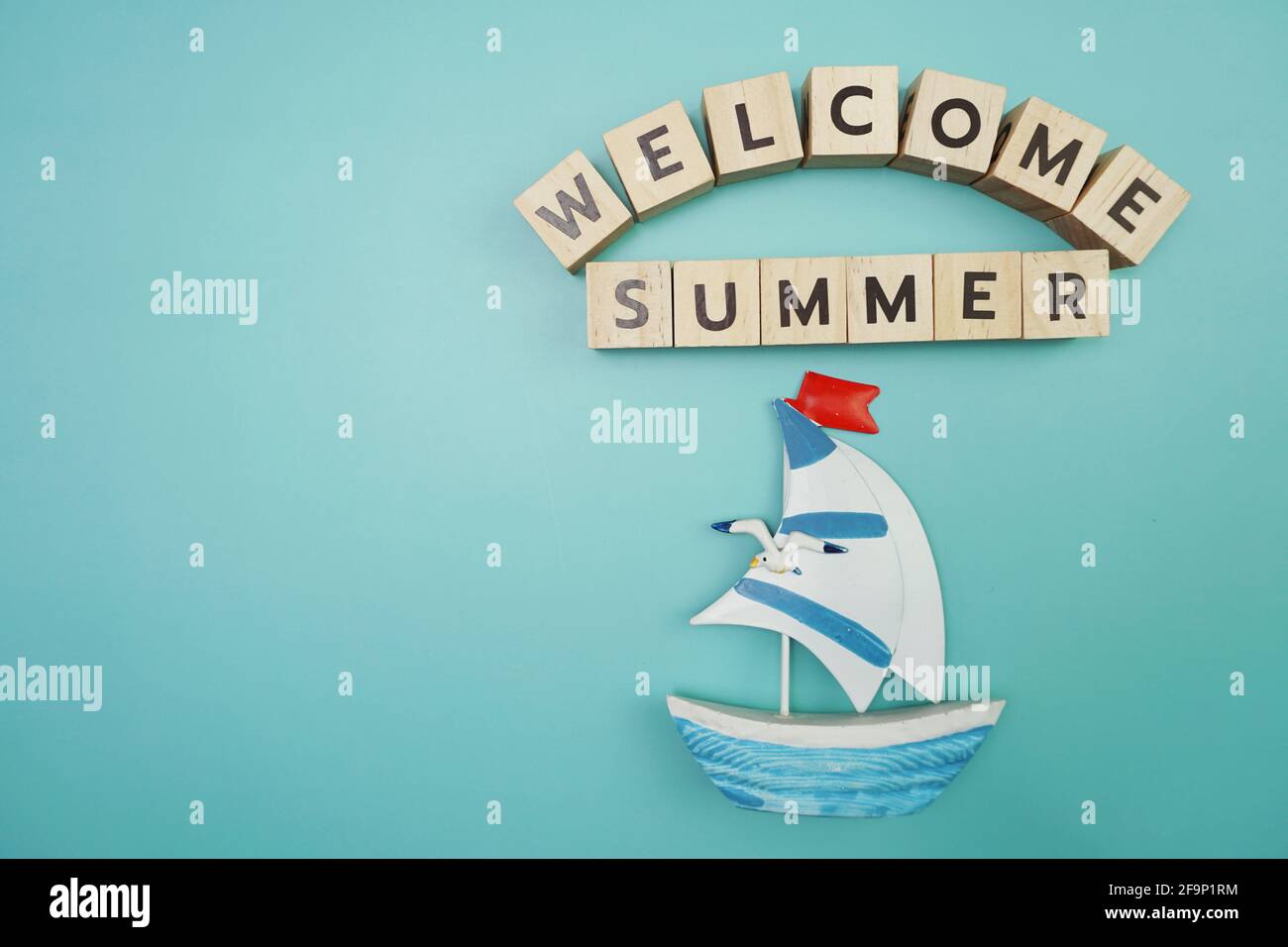 Welcome Summer message alphabet letter with sailboat on blue background ...