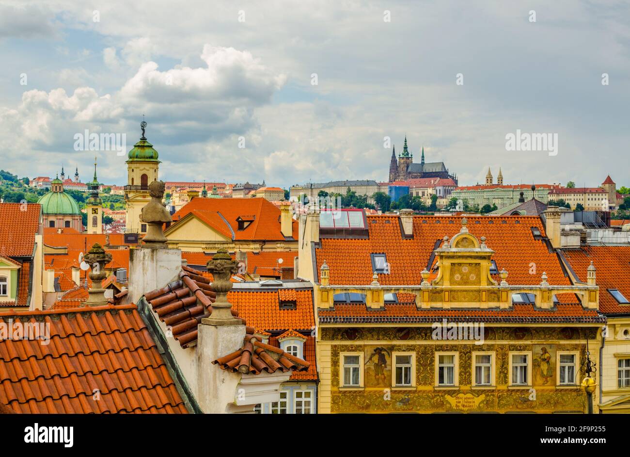 aerial view of prague castle hidden behind red-tile rofftops Stock ...