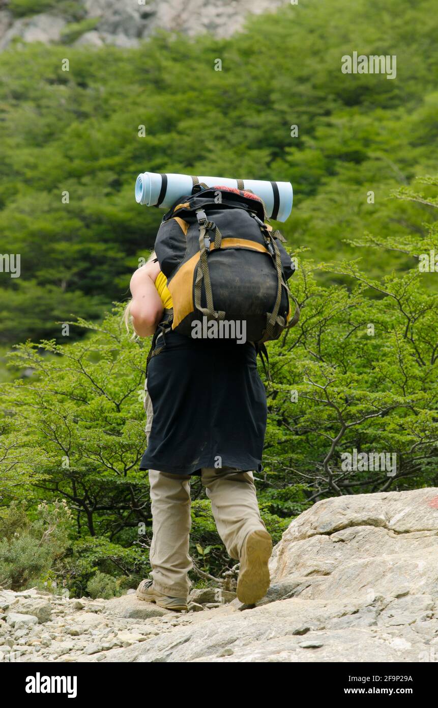 backpacker doing trekking. climbing the mountain in solitude. Outdoor ...