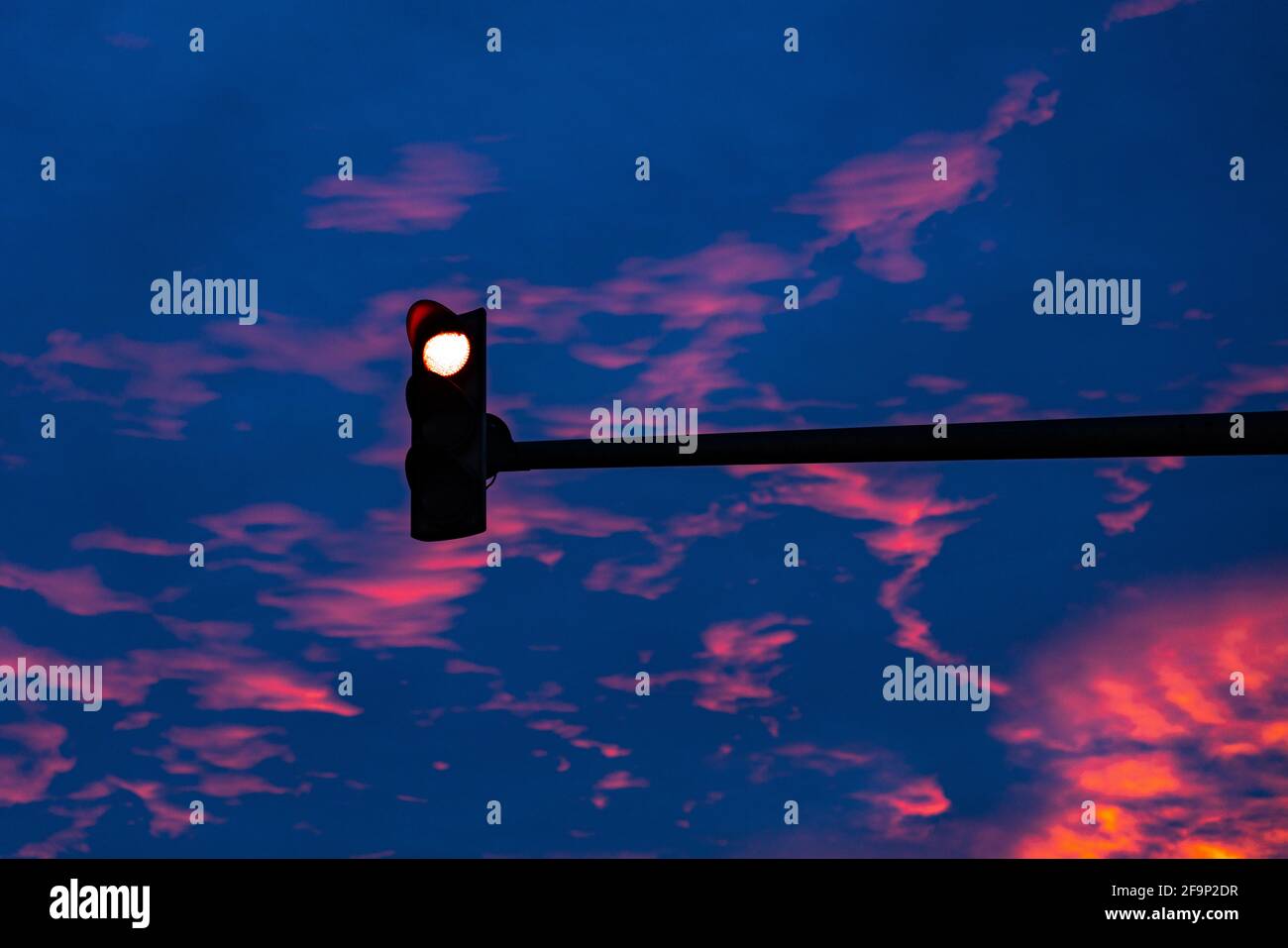 Beautiful orange sunset at traffic light Stock Photo - Alamy