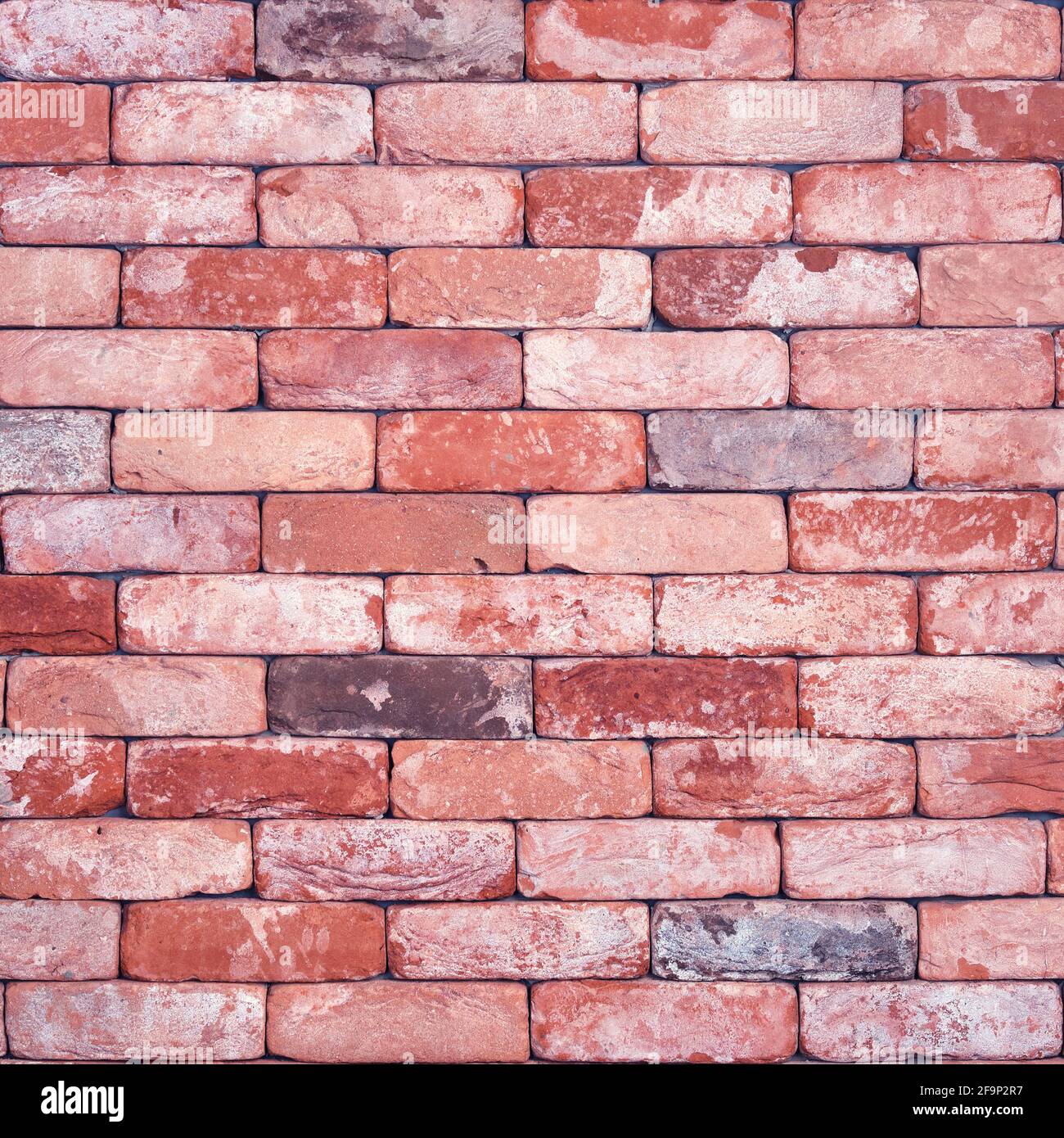 Retro red brick wall. Vintage wall made of bricks of different shades ...