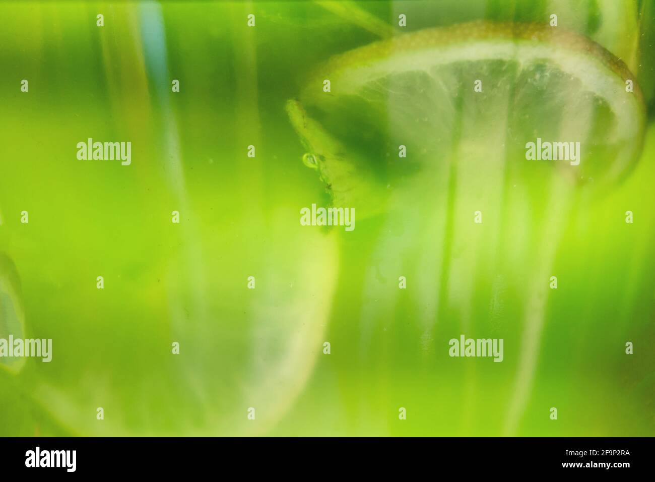 Food background, green drink behind glass with lime inside Stock Photo ...