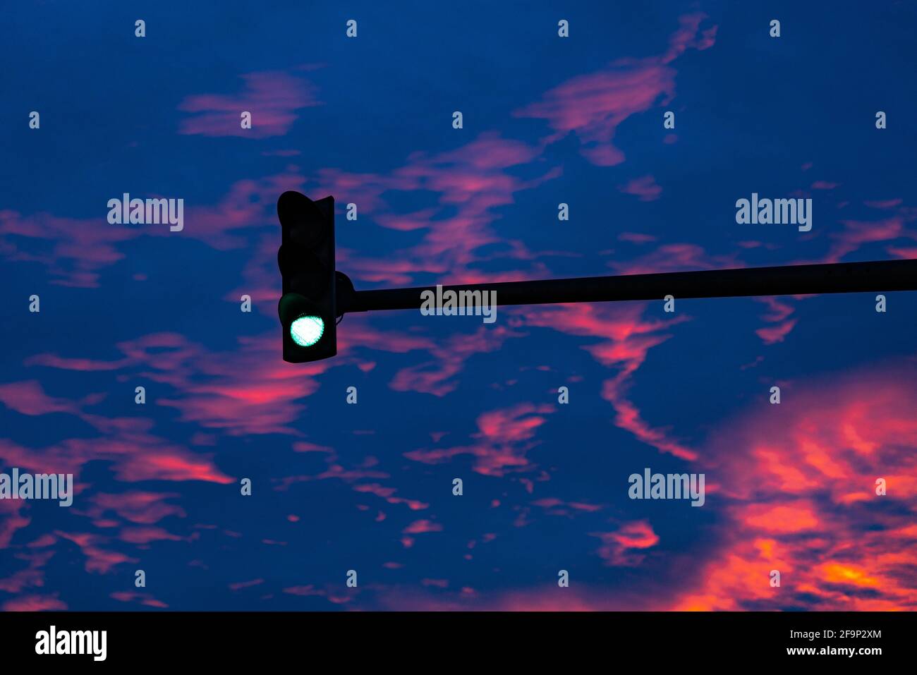 Beautiful orange sunset at traffic light Stock Photo - Alamy