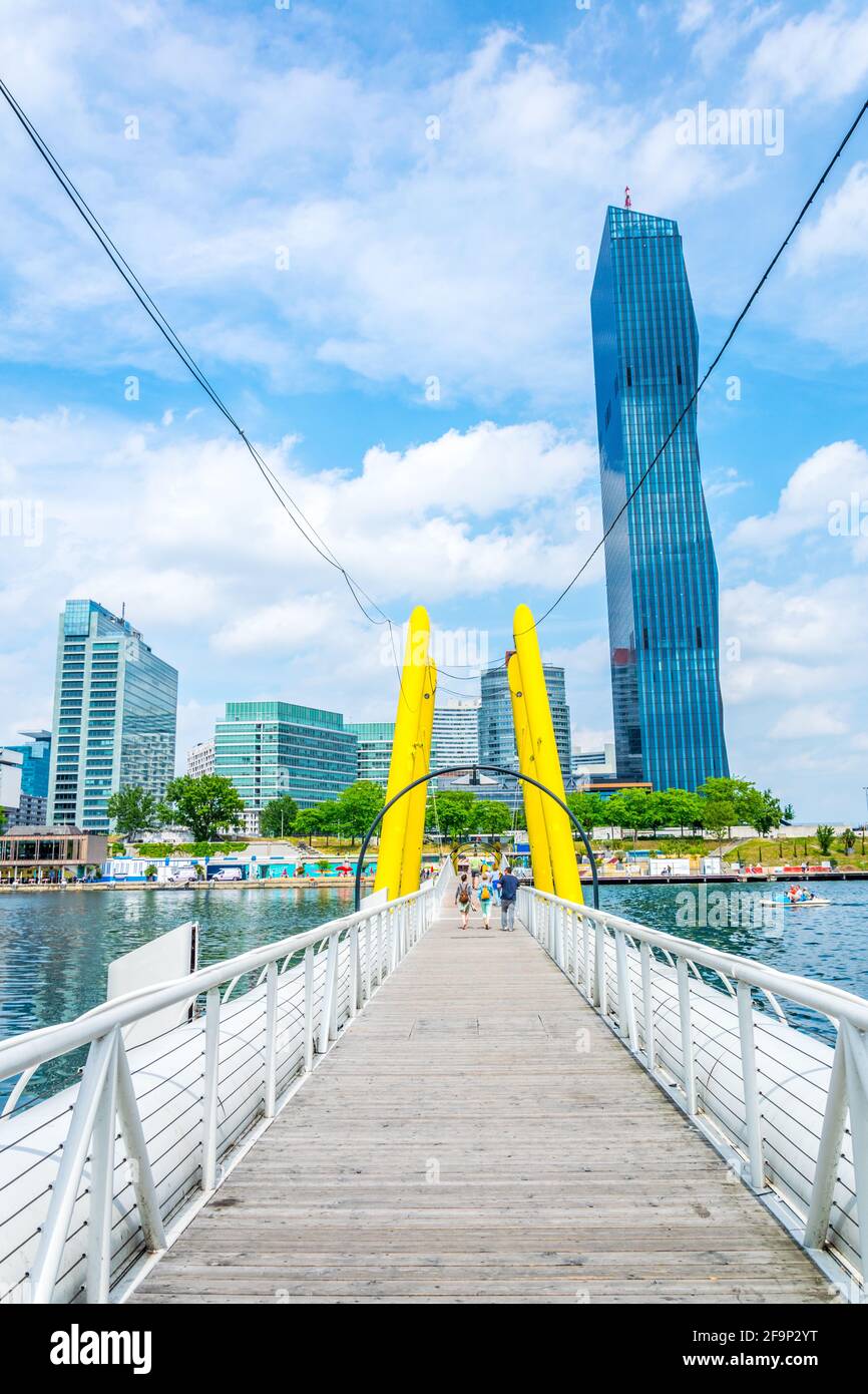 View of a floating bridge over danube river near VIC and Donauturm in ...
