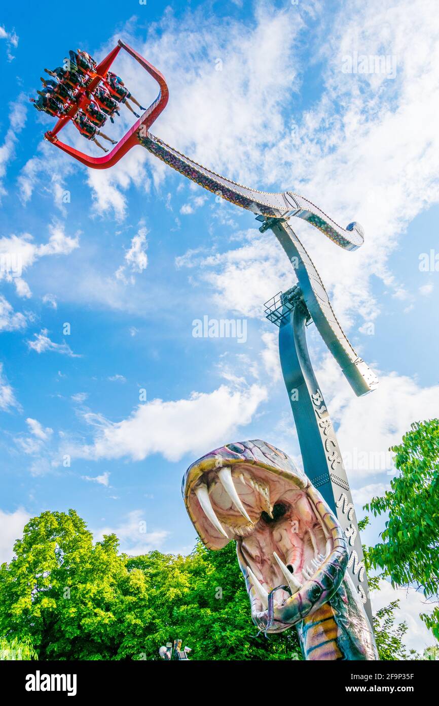 Detail of people levitating in the air on the black mamba attraction ...