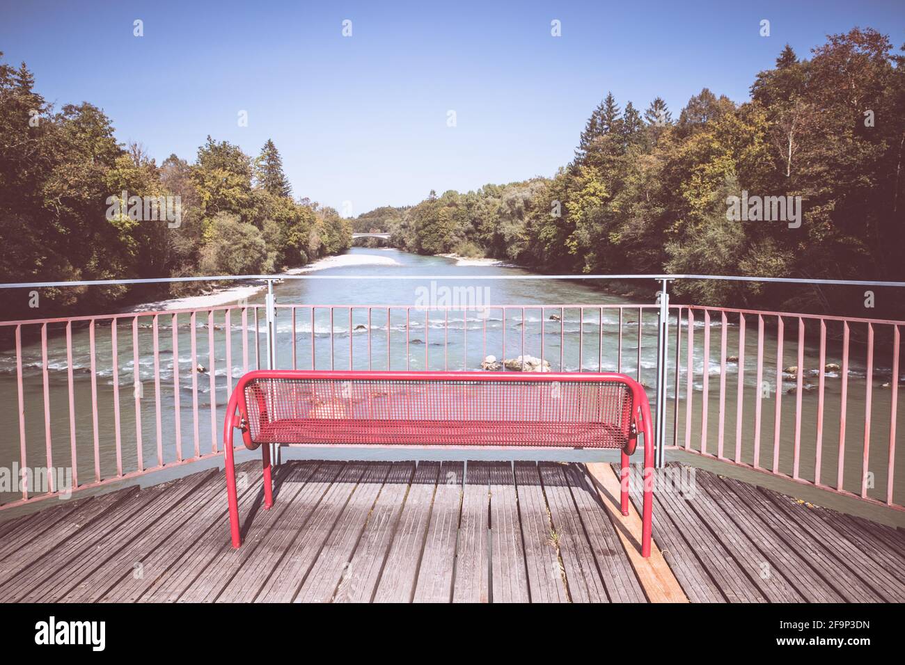 Red bench on a wooden bridge, river Stock Photo - Alamy
