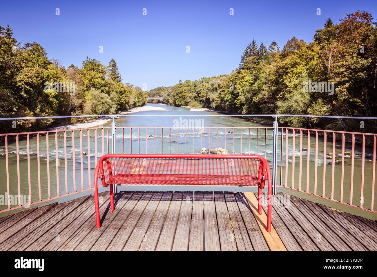 Red bench on a wooden bridge, river Stock Photo - Alamy