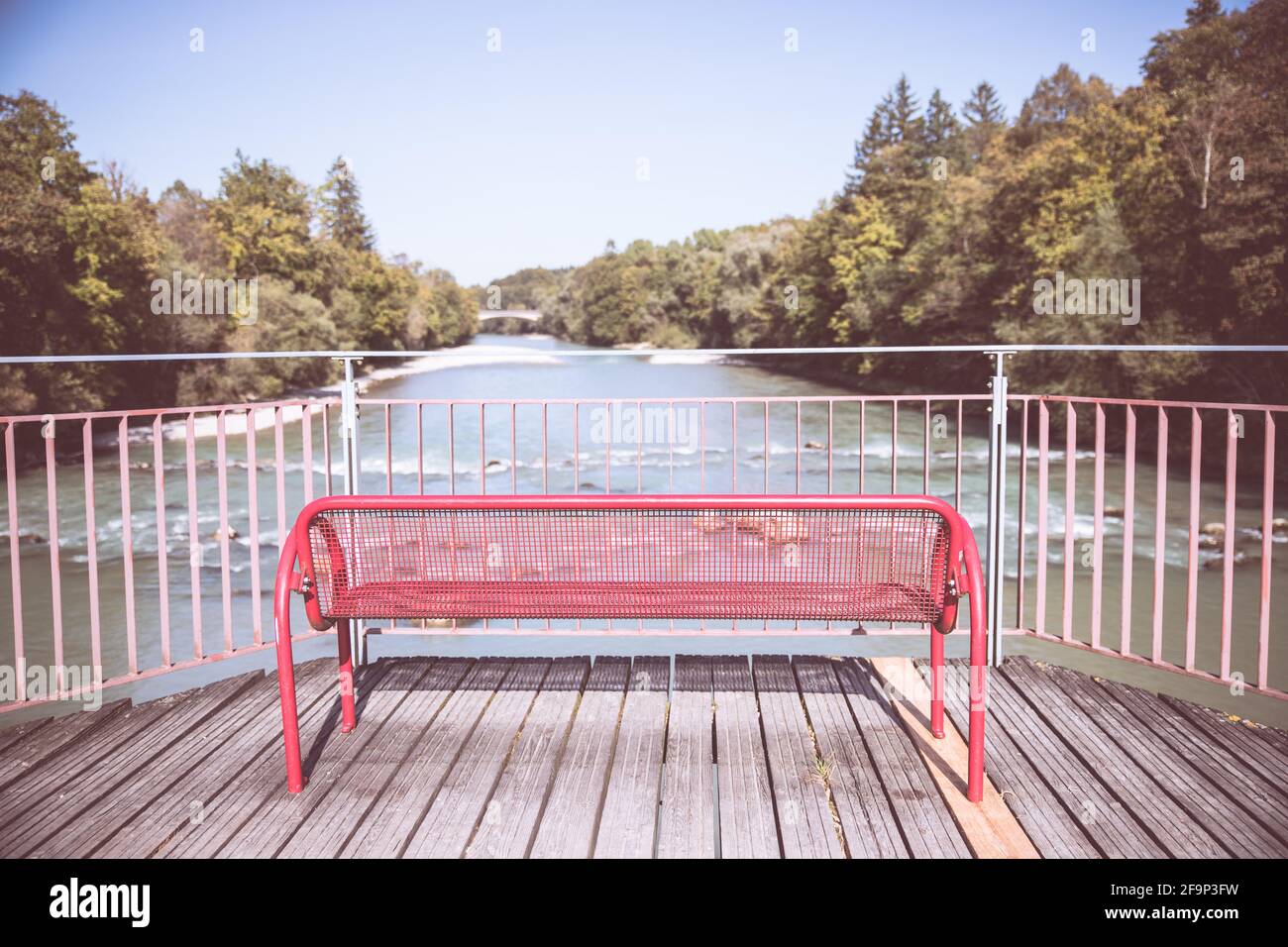 Red bench on a wooden bridge, river Stock Photo - Alamy