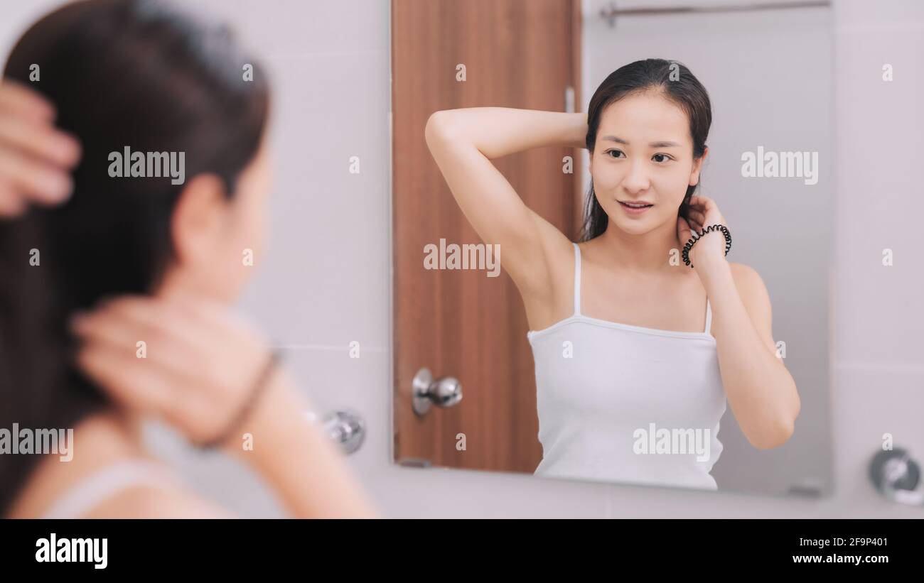 Girl taking care refreshing her hairstyle. Haircare concept Stock Photo ...