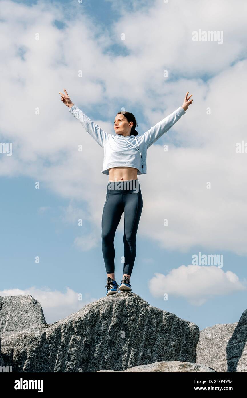 Woman arms raised up to blue sky, celebrating freedom. Positive human ...
