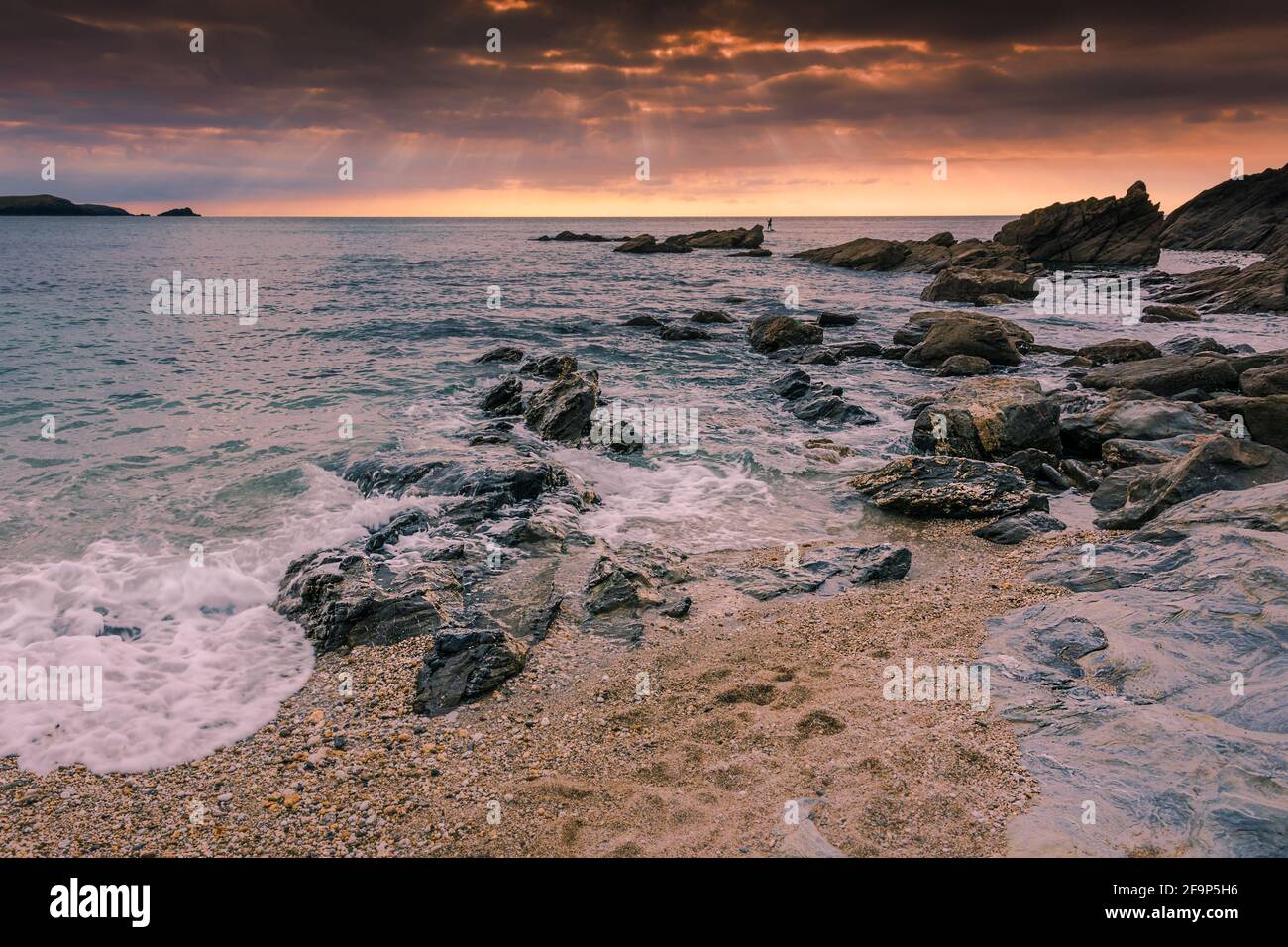 A colourful sunset over Fistral Bay in Newquay in Cornwall Stock Photo ...
