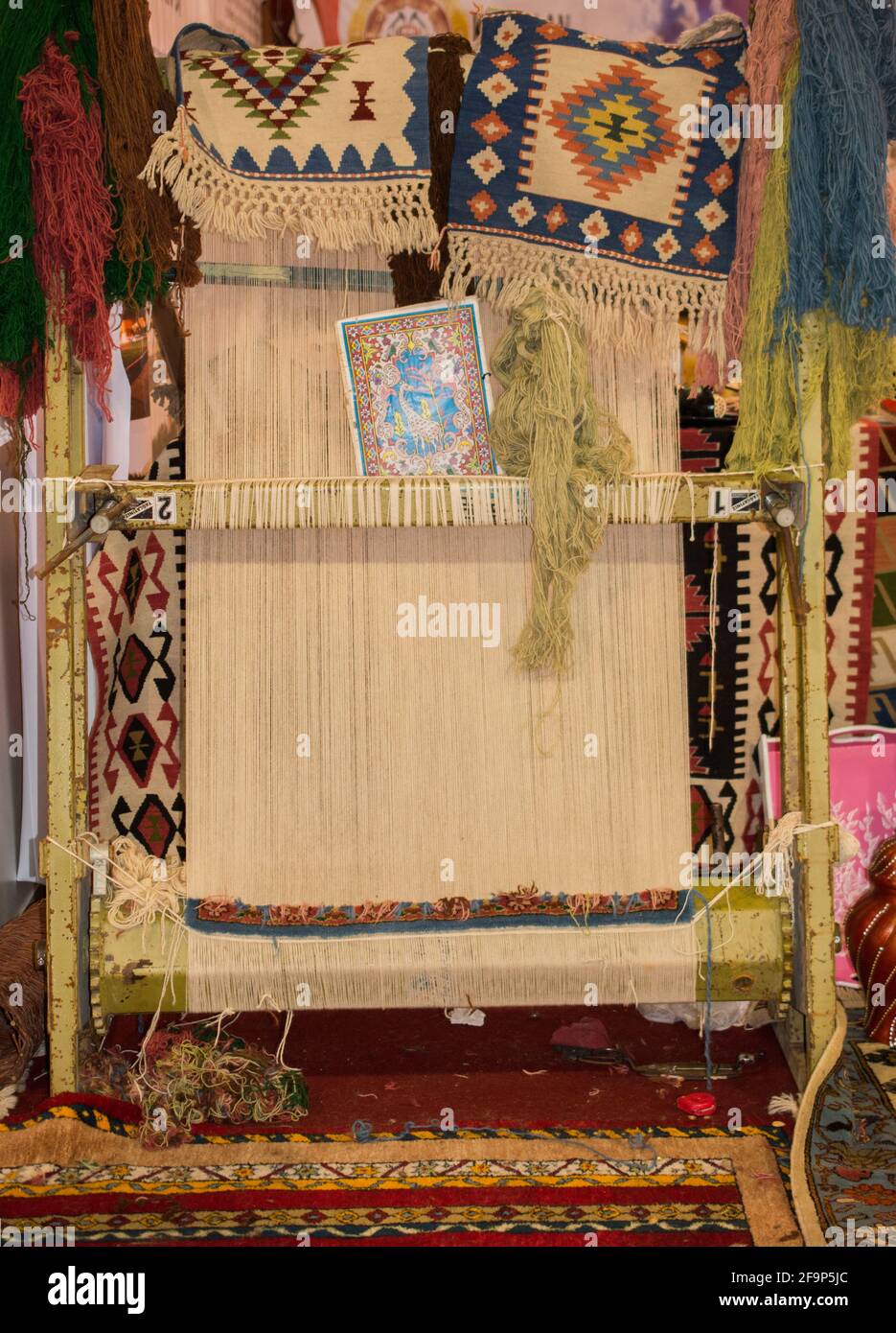 Vertical shot of the traditional rug weaving process Stock Photo - Alamy