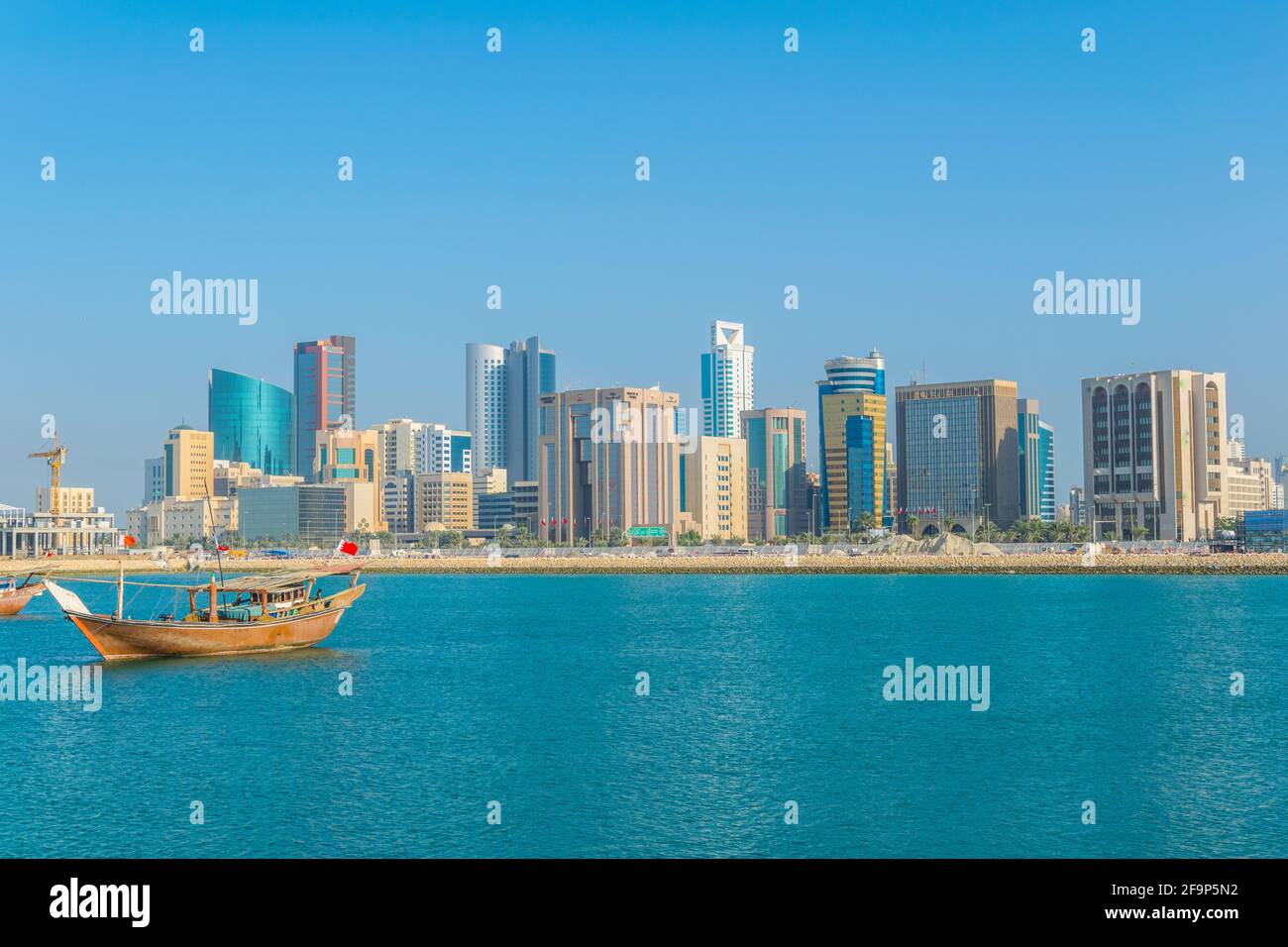 Skyline of Manama with a dhow boat, Bahrain Stock Photo - Alamy