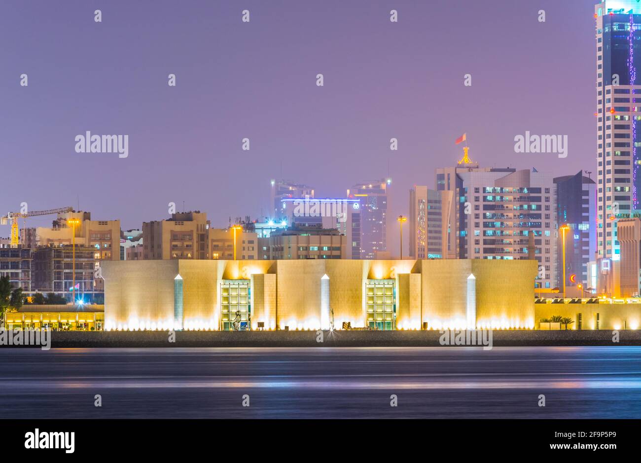 Skyline of Manama with the Bahrain National museum during sunset ...