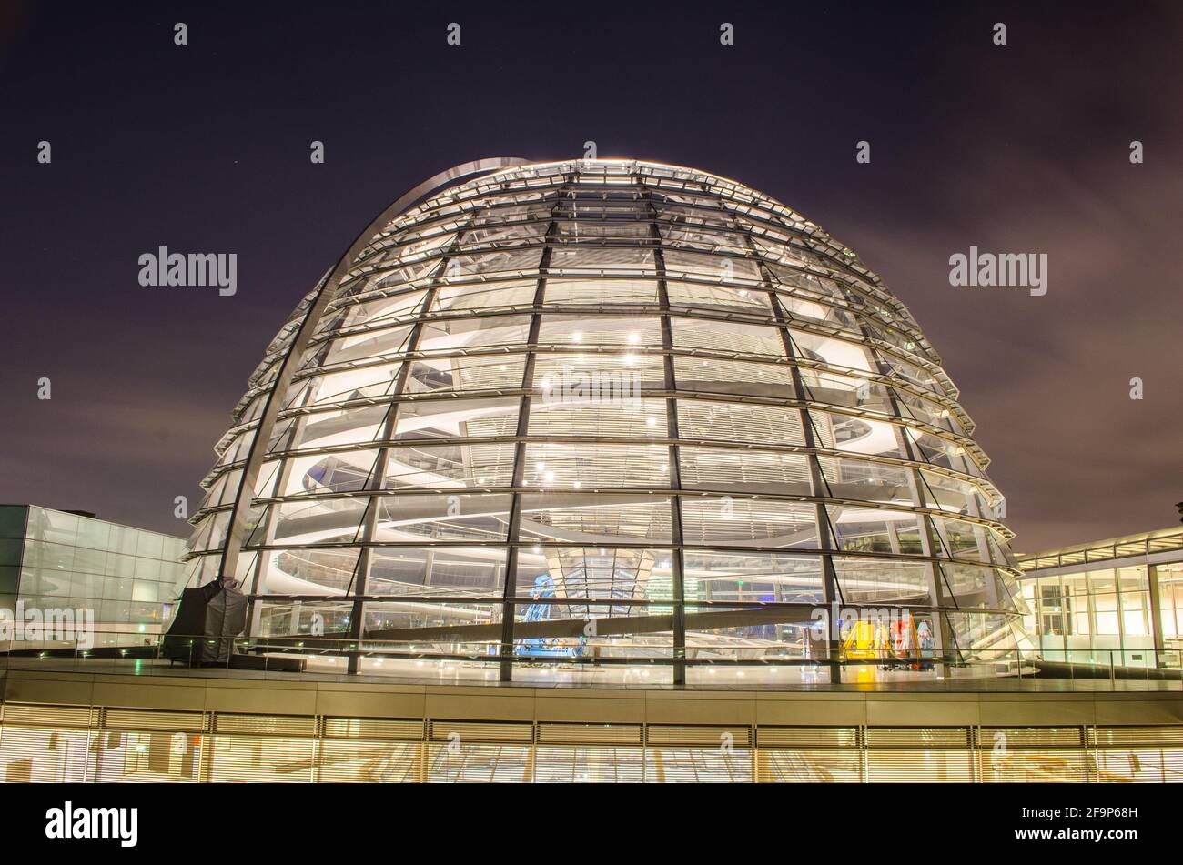 illuminated cupola situated on the top of reichstag building in berlin ...