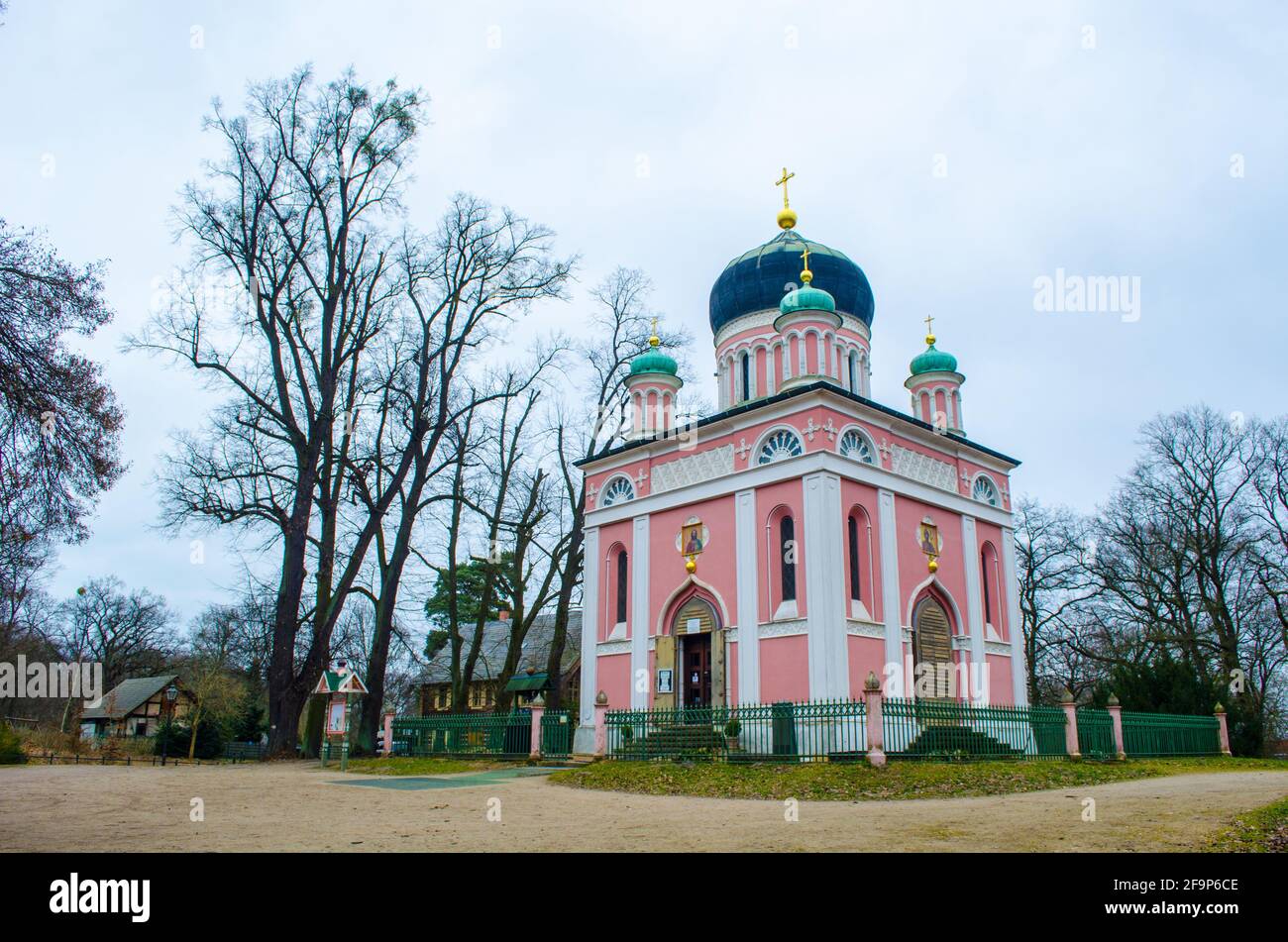 view of pink orthodox church situated near former russian colony ...