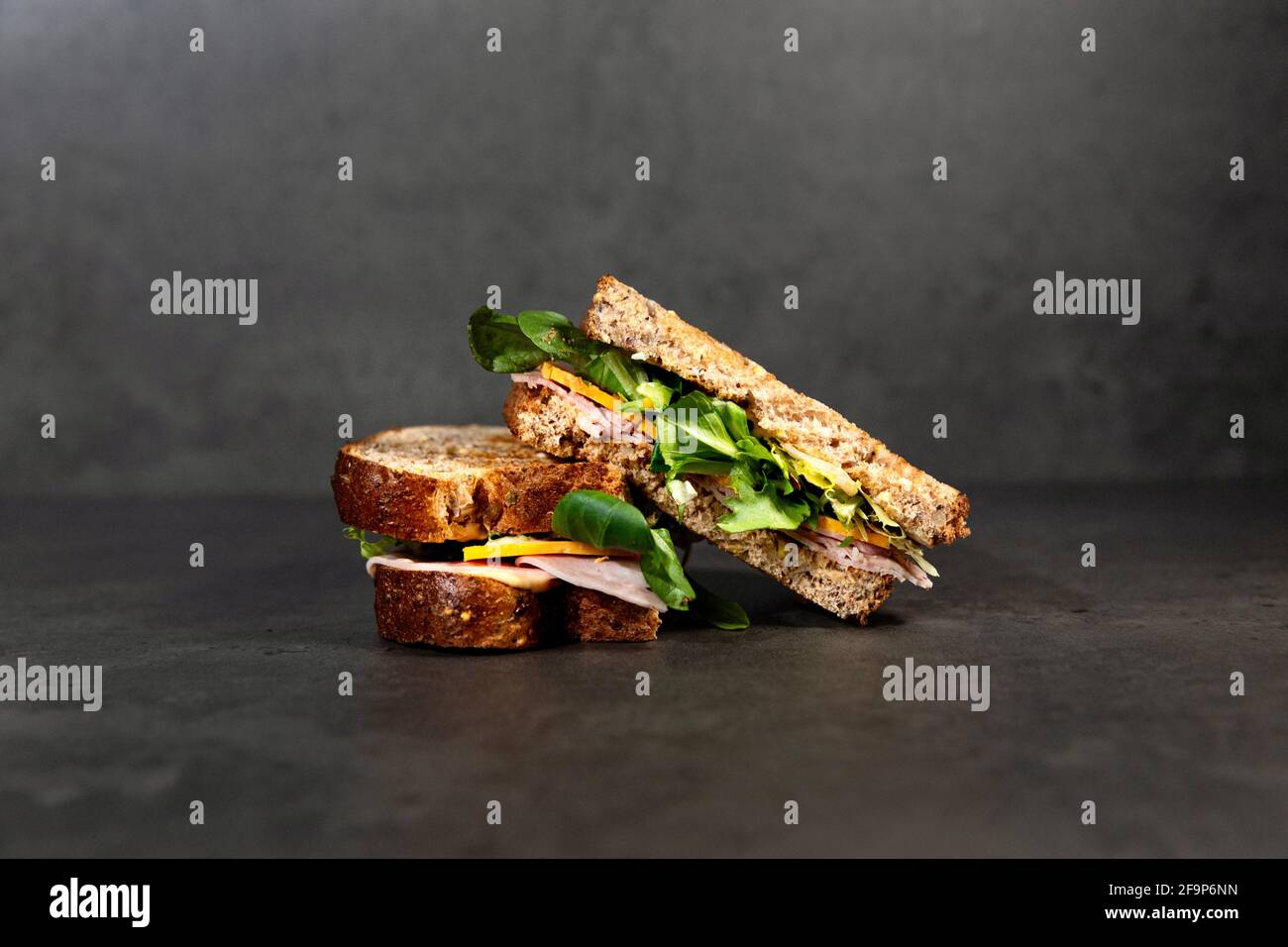 a freshly prepared sandwich against a minimal grey background Stock ...